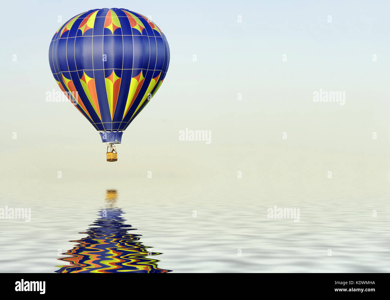 Colorful hot air balloon over water Stock Photo - Alamy