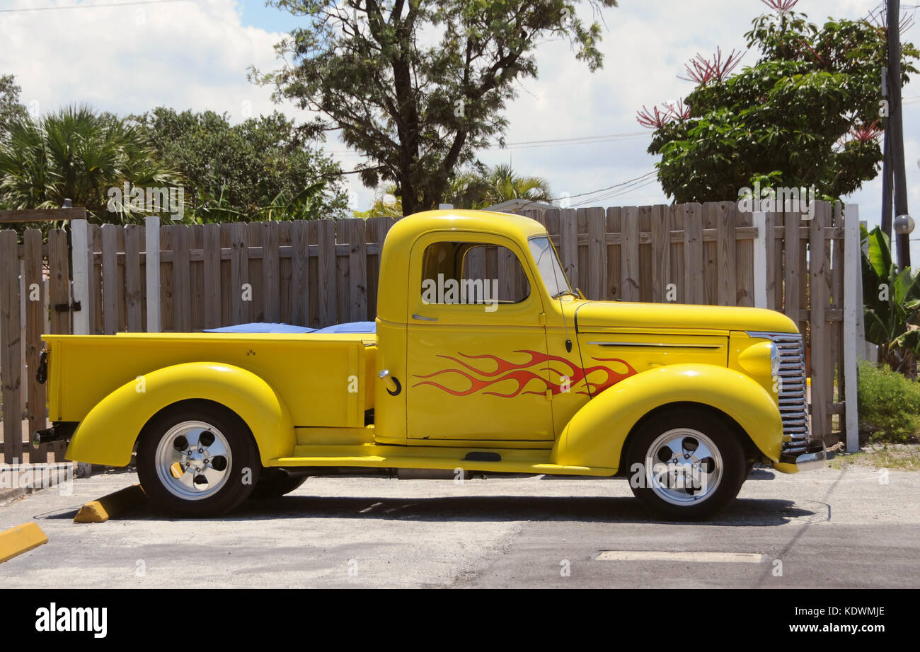 Small pickup truck with bright yellow color Stock Photo - Alamy