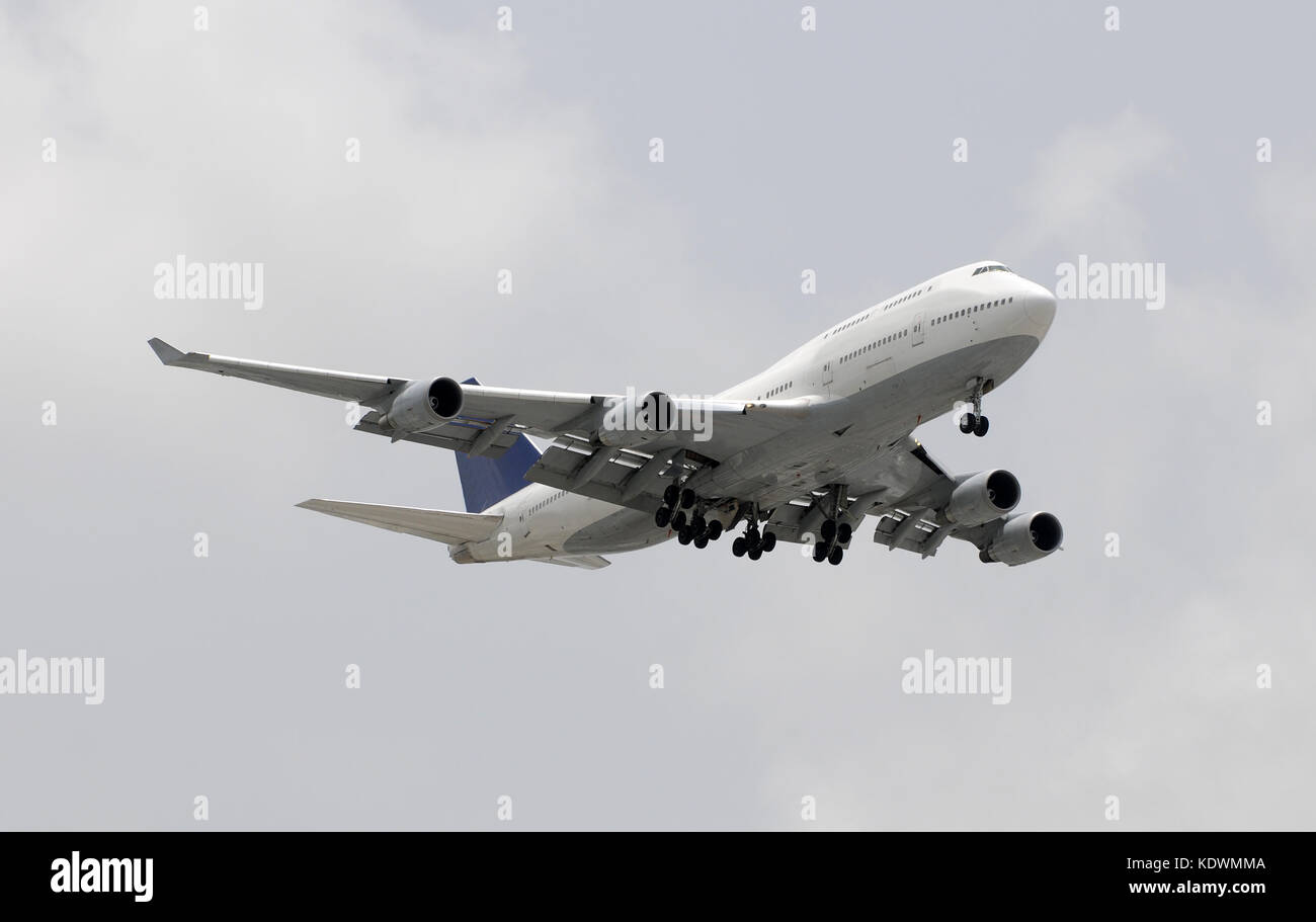 Heavy widebody passenger airplane in flight landing Stock Photo - Alamy