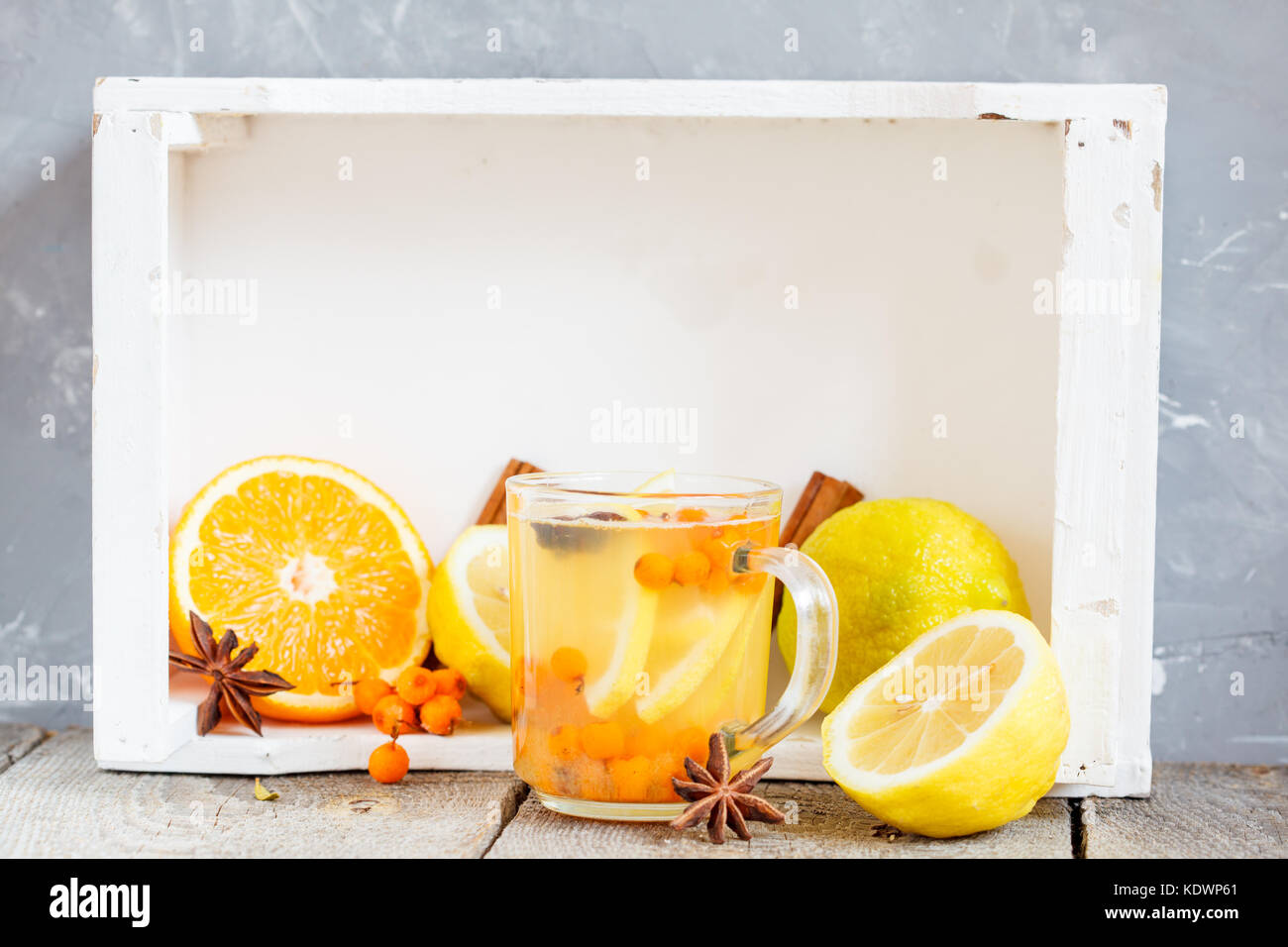 Hot drink with lemon buckthorn, autumn curative drink Stock Photo - Alamy