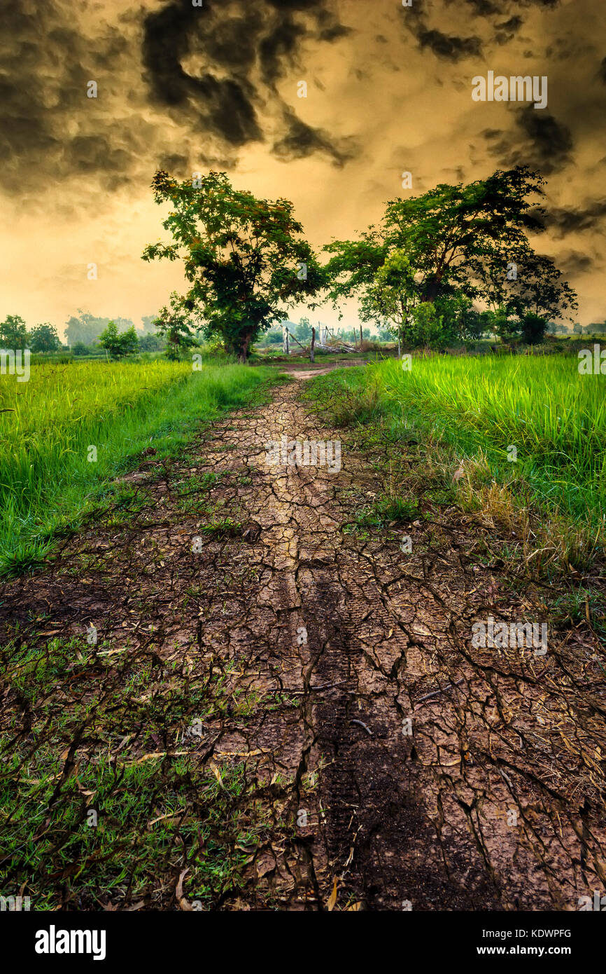 rain clouds over rural road landscape Stock Photo - Alamy