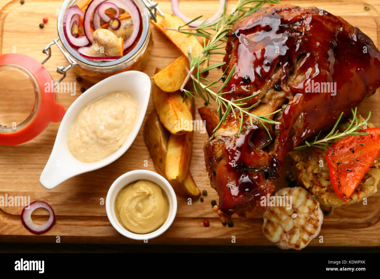 Meat with sauce and garnish, food above Stock Photo - Alamy
