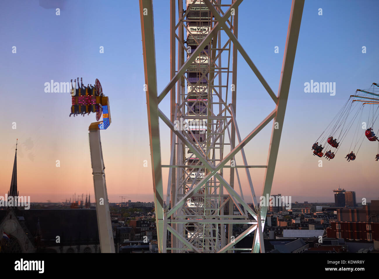 Fun fair in Dam Square Amsterdam at sunset Stock Photo - Alamy