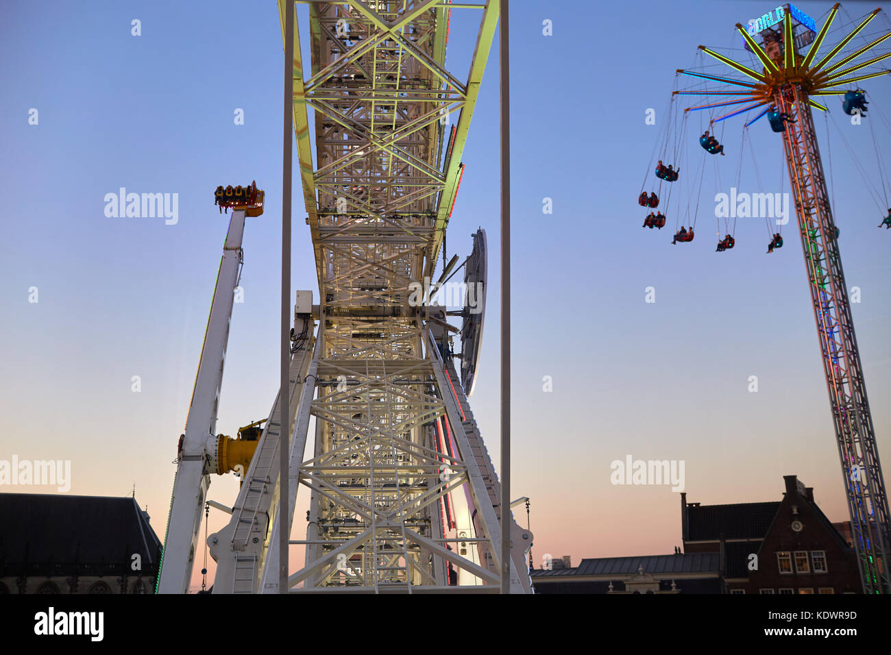 Fun fair in Dam Square Amsterdam at sunset Stock Photo - Alamy