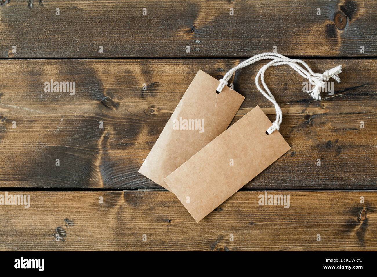 Two empty cardboard tags ready for text or other concept, laying on a ...