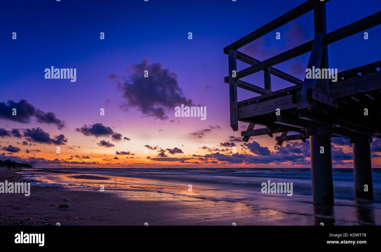 Panoramic picture of a sunset over wooden pier on the sea beach in ...