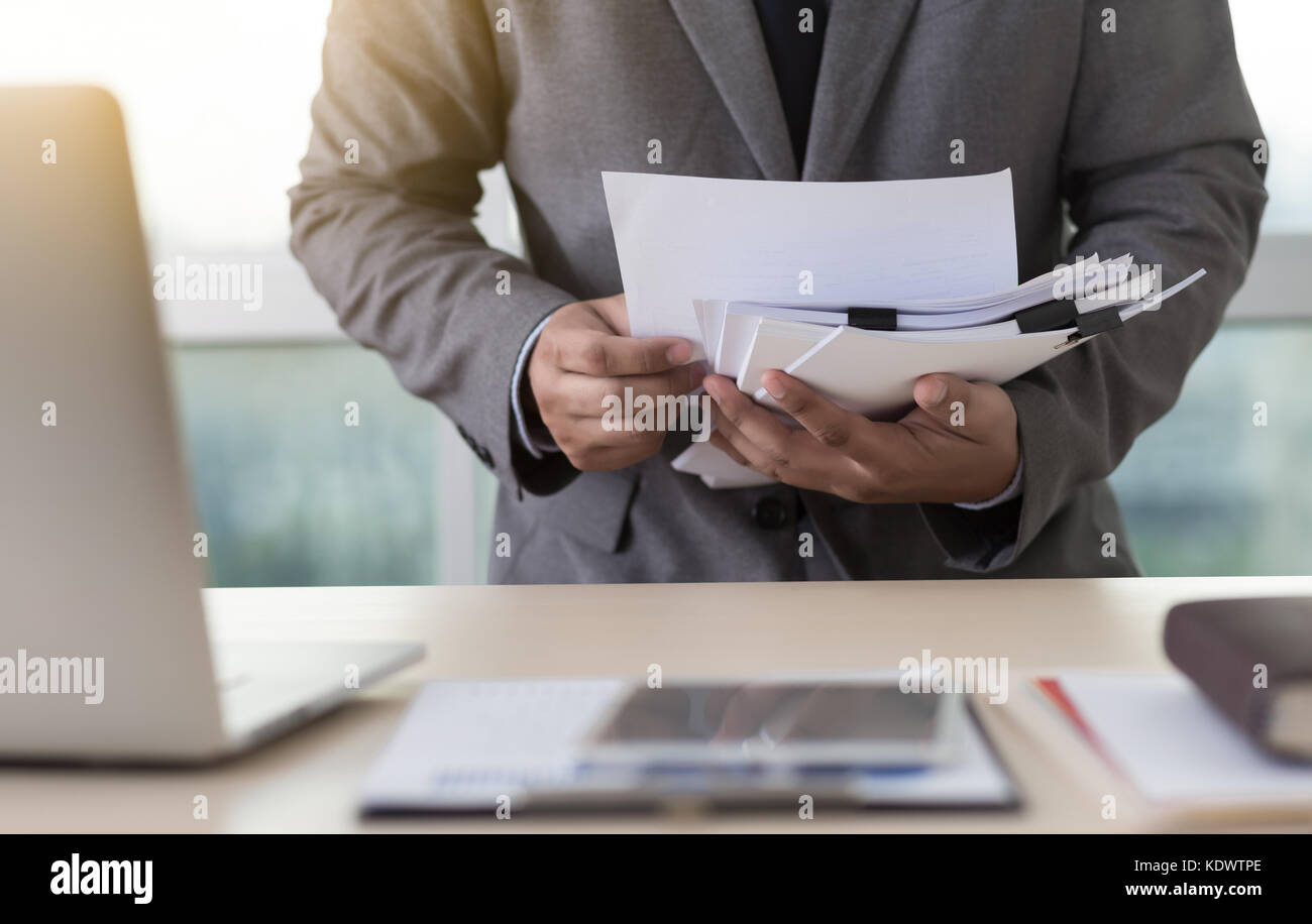 Businessman working reading documents graph financial to job succes ...
