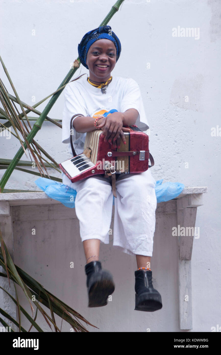 A female accordion player sings during the Sauti za Busara music ...