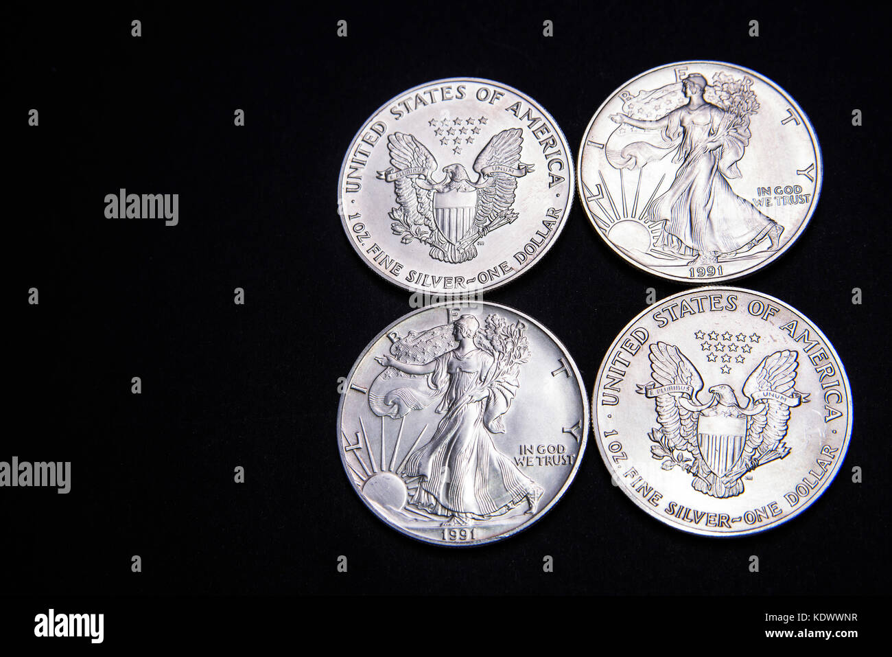 American silver dollars from both sides on the black background Stock ...