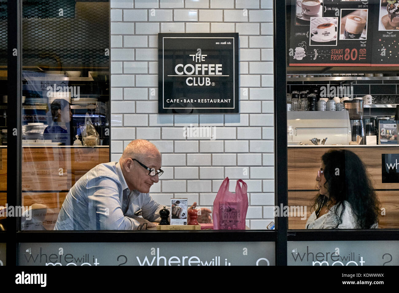 Coffe shop. People drinking coffee and talking Stock Photo - Alamy