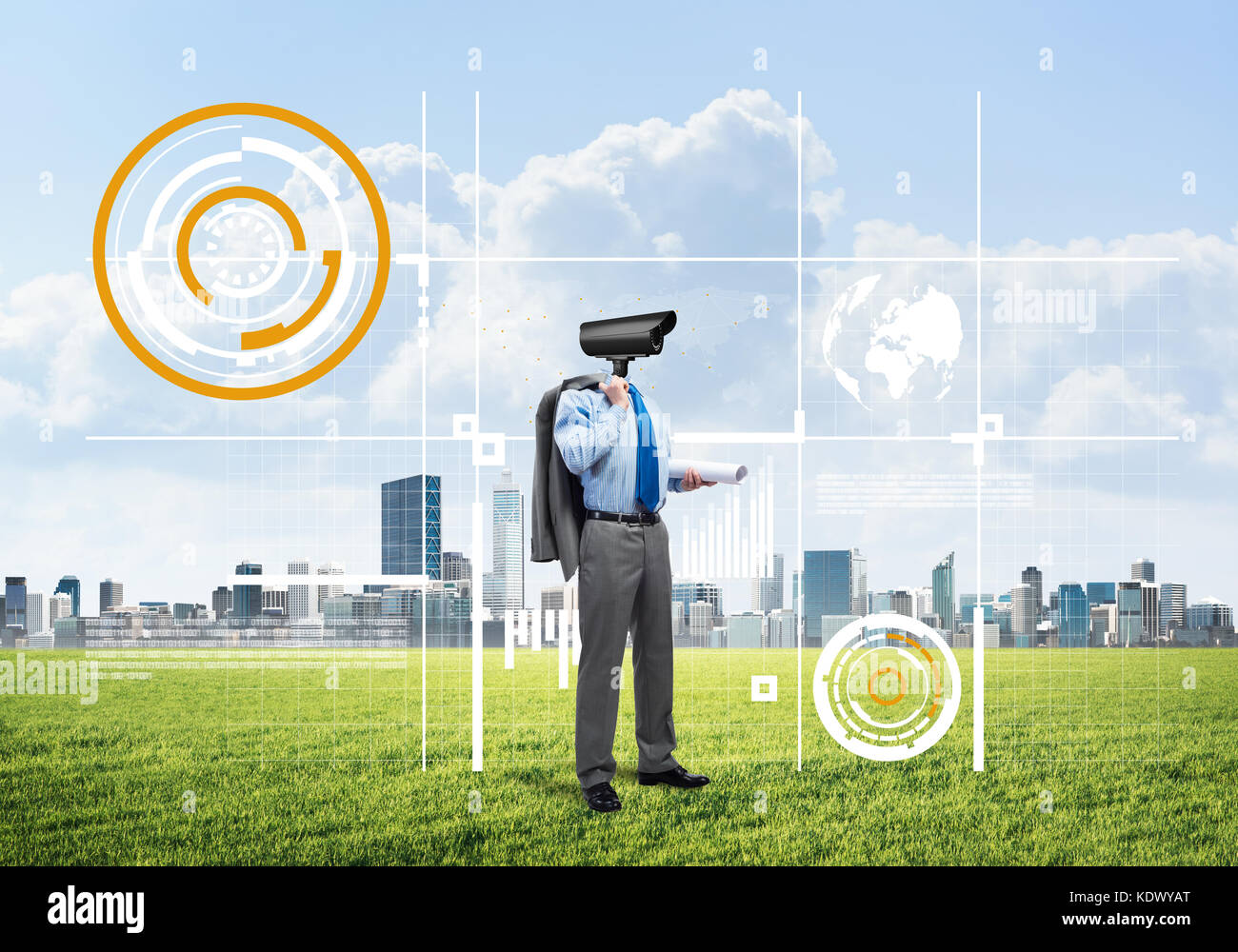 Camera headed man standing on green grass against modern cityscape ...