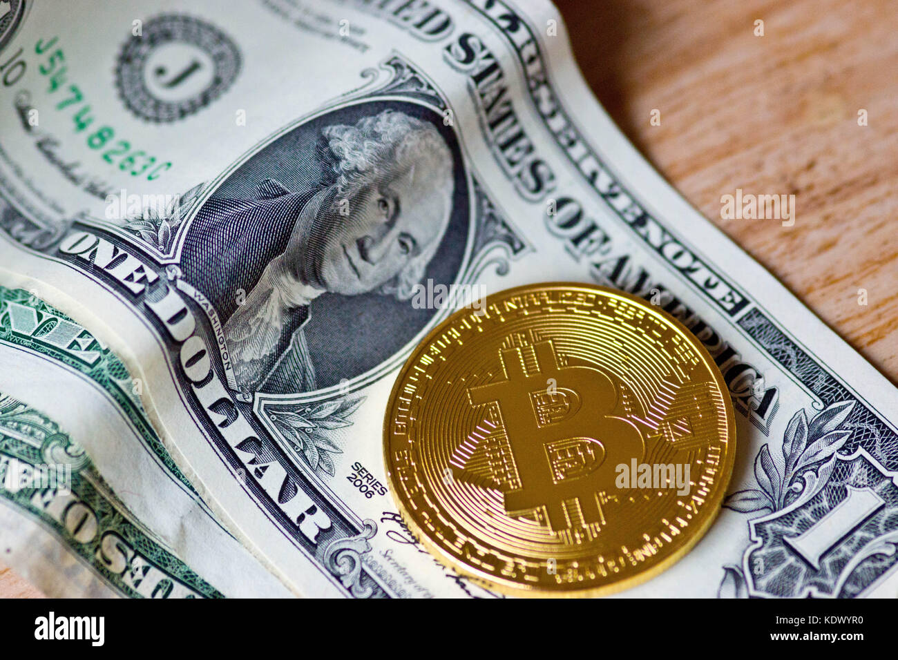 Bitcoin replica on one dollar bill Stock Photo - Alamy