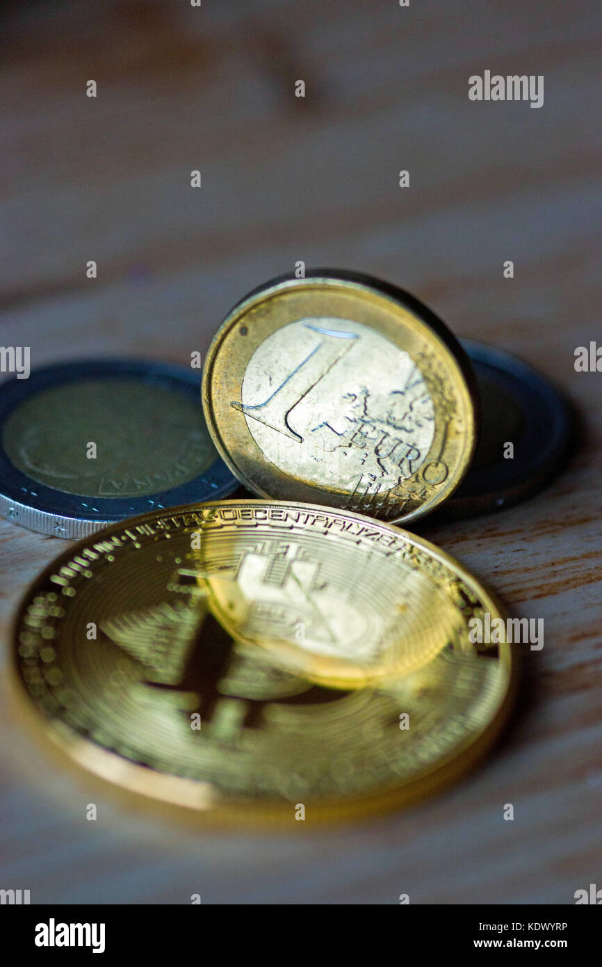 Bitcoin replica and one Euro coin Stock Photo - Alamy