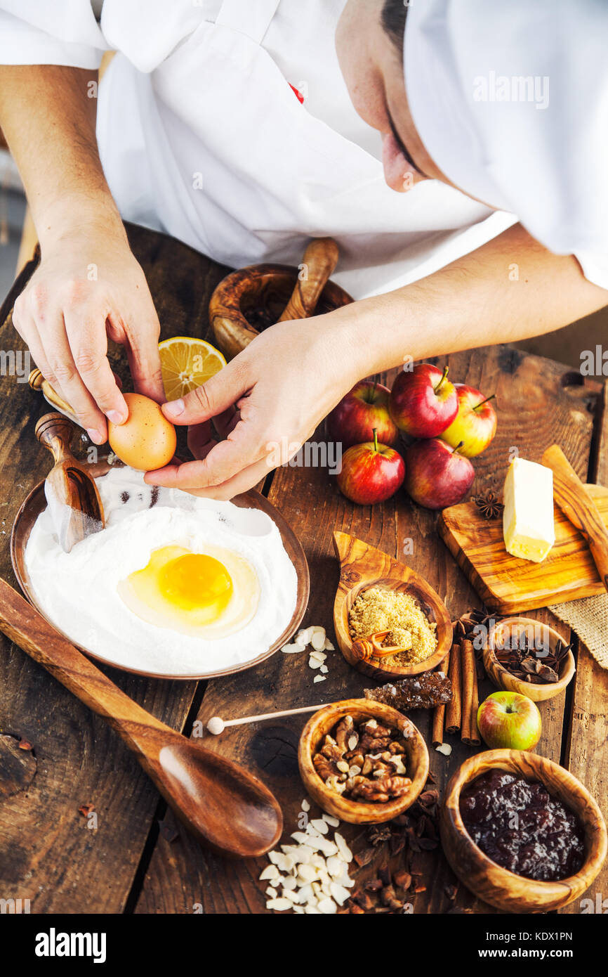 Baking concept background. Baker with ingredients for pastry desserts ...