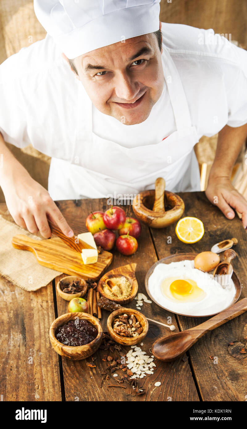 Baking concept background. Baker with ingredients for pastry desserts ...