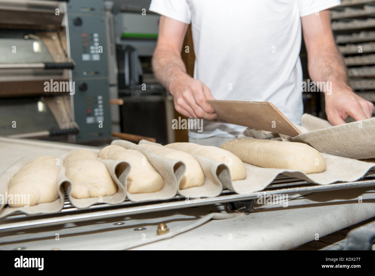 the baker prepares bread dough, close up on his hands Stock Photo - Alamy
