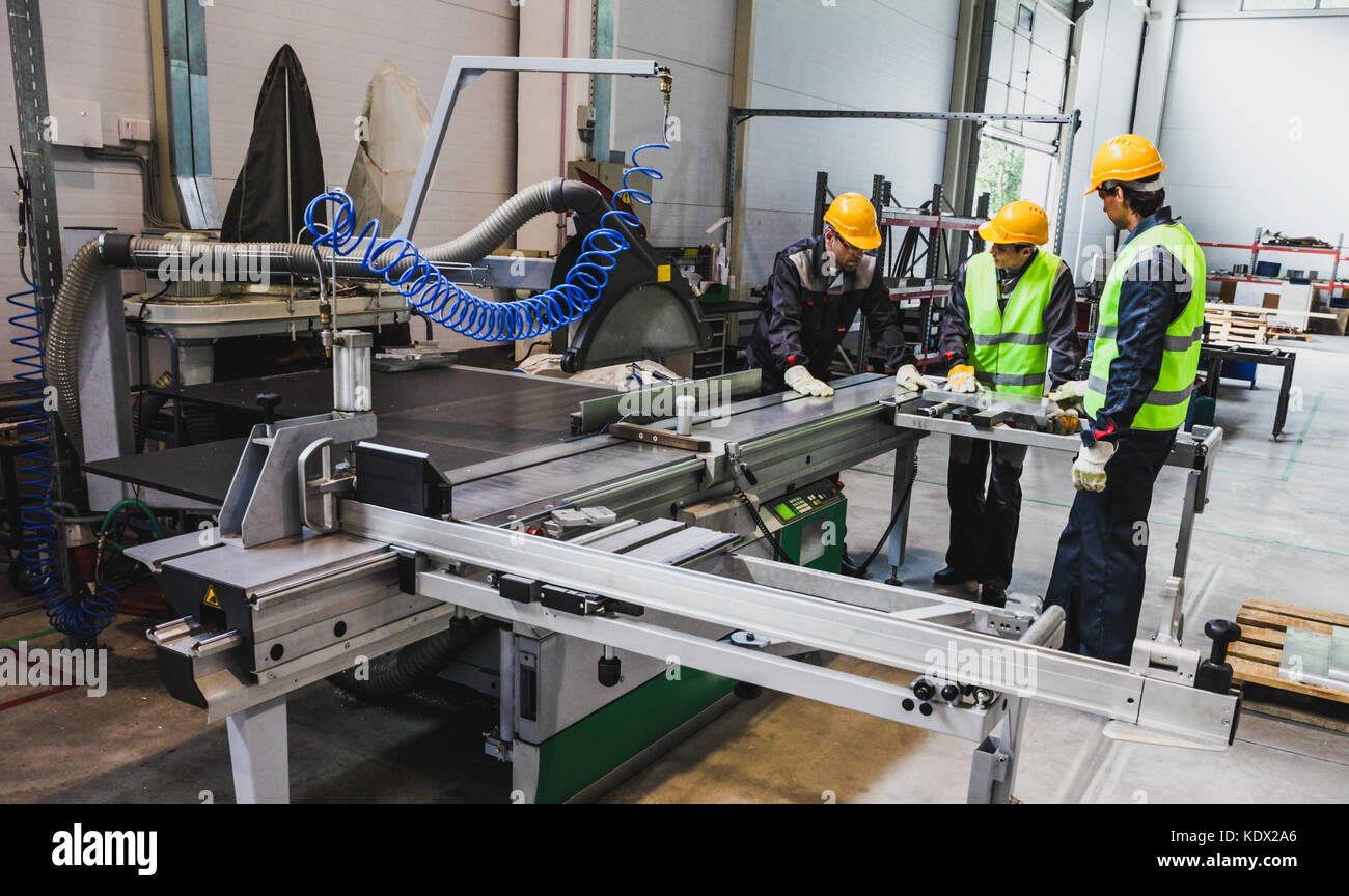 CNC machine shop with lathes, technicians and workers Stock Photo - Alamy