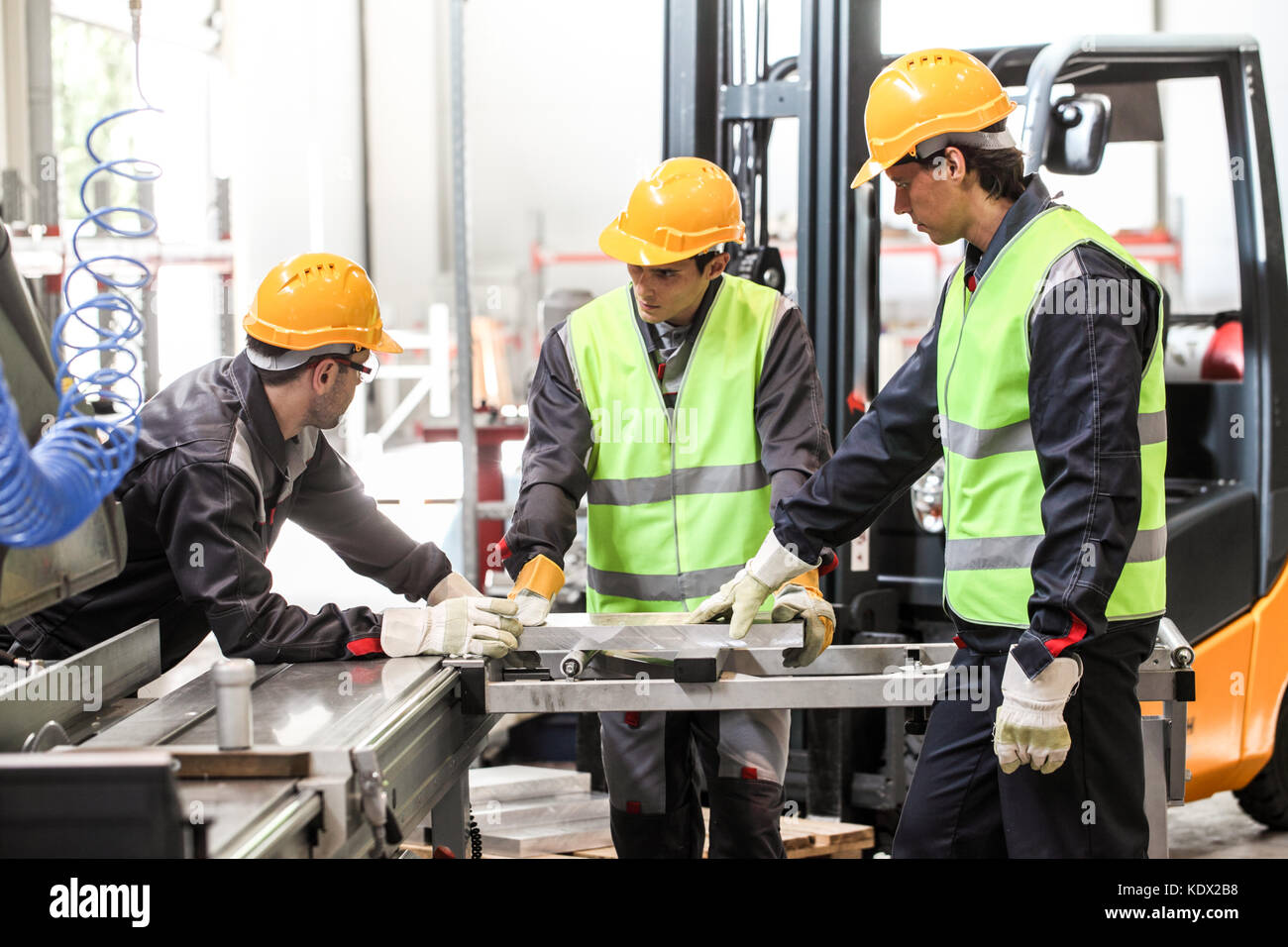 CNC machine shop with lathes, technicians and workers Stock Photo - Alamy