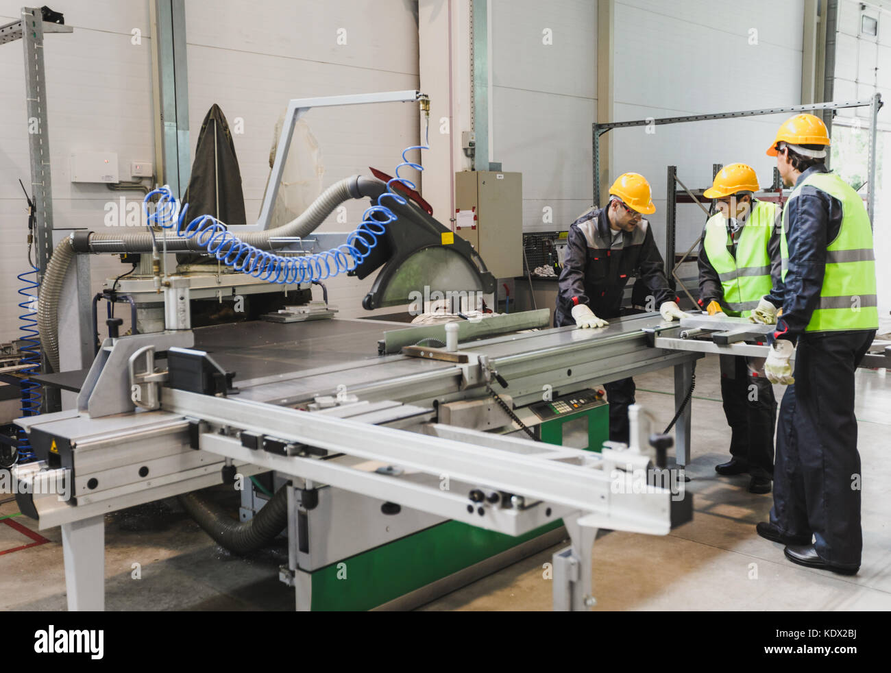 CNC machine shop with lathes, technicians and workers Stock Photo - Alamy