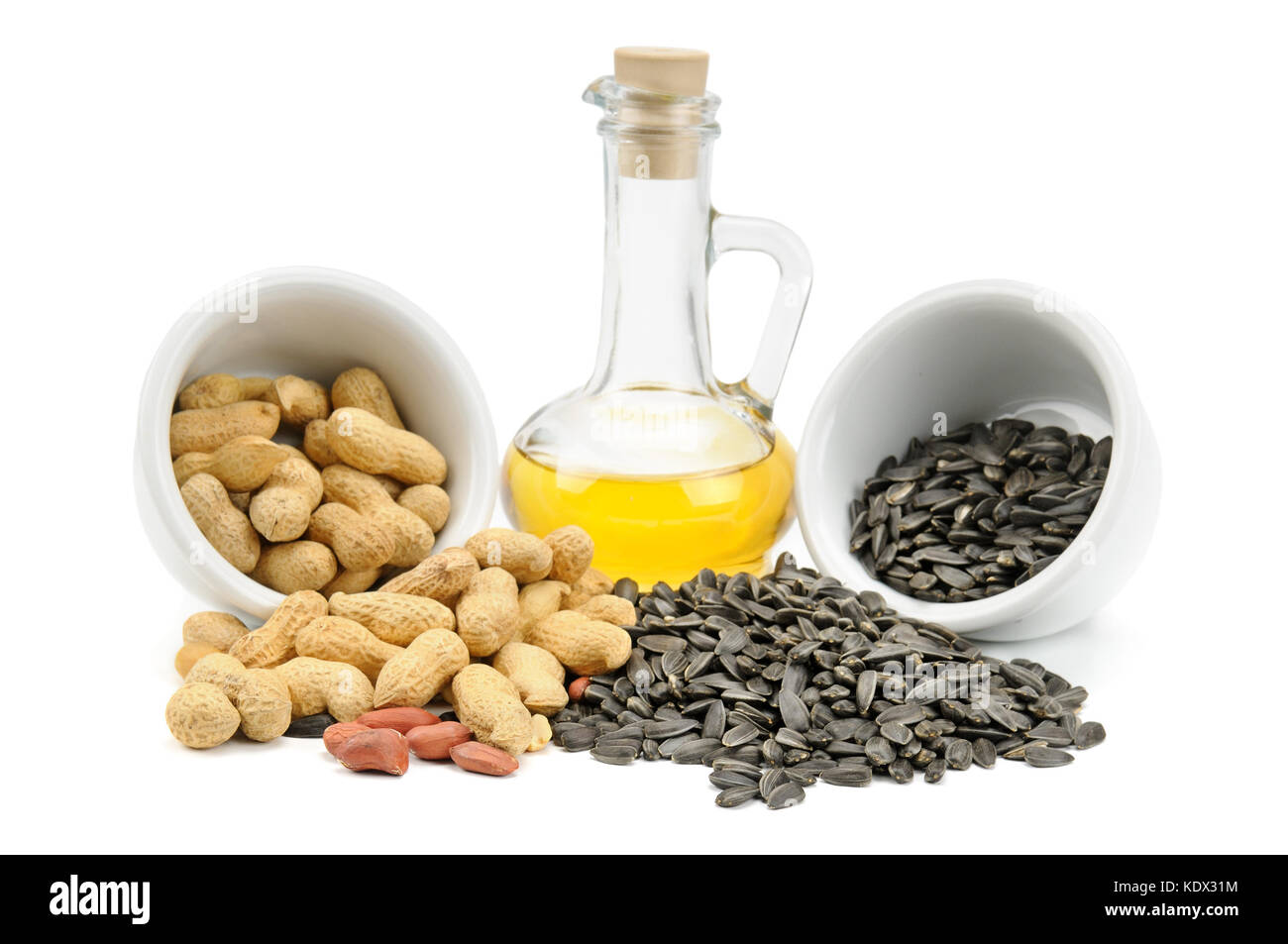 Sunflower seeds, peanuts and oil isolated on a white background Stock ...