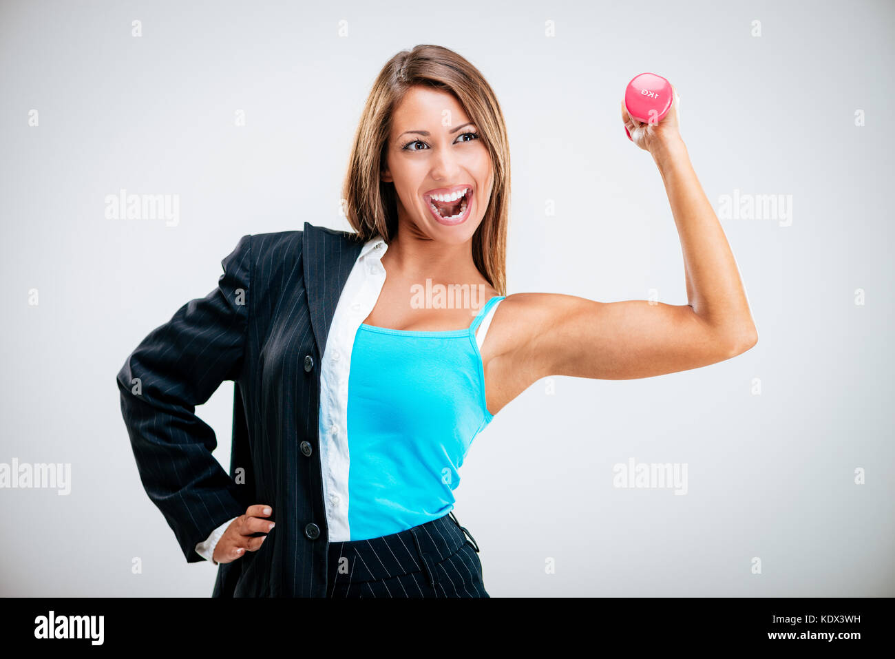 Multitasking businesswoman balancing life work and fitness Stock Photo ...