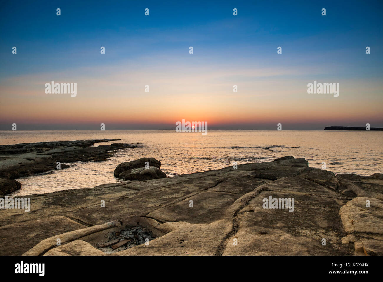 A beautiful sunrise over the coastline in Selmun, Malta Stock Photo - Alamy