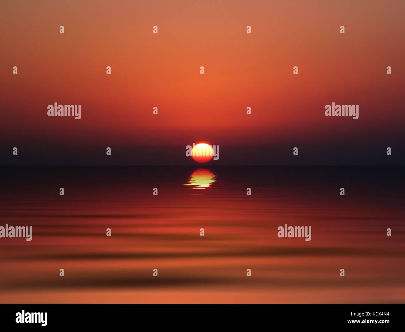 Sunset over calm waters Stock Photo - Alamy