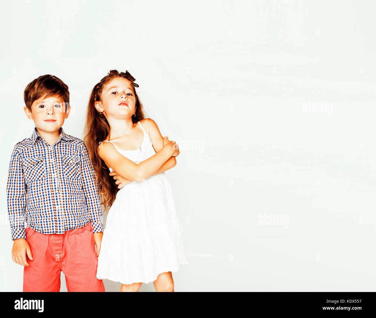 little cute boy and girl hugging playing on white background, ha Stock Photo - Alamy