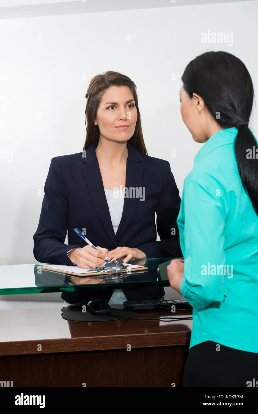 People registering hi-res stock photography and images - Alamy
