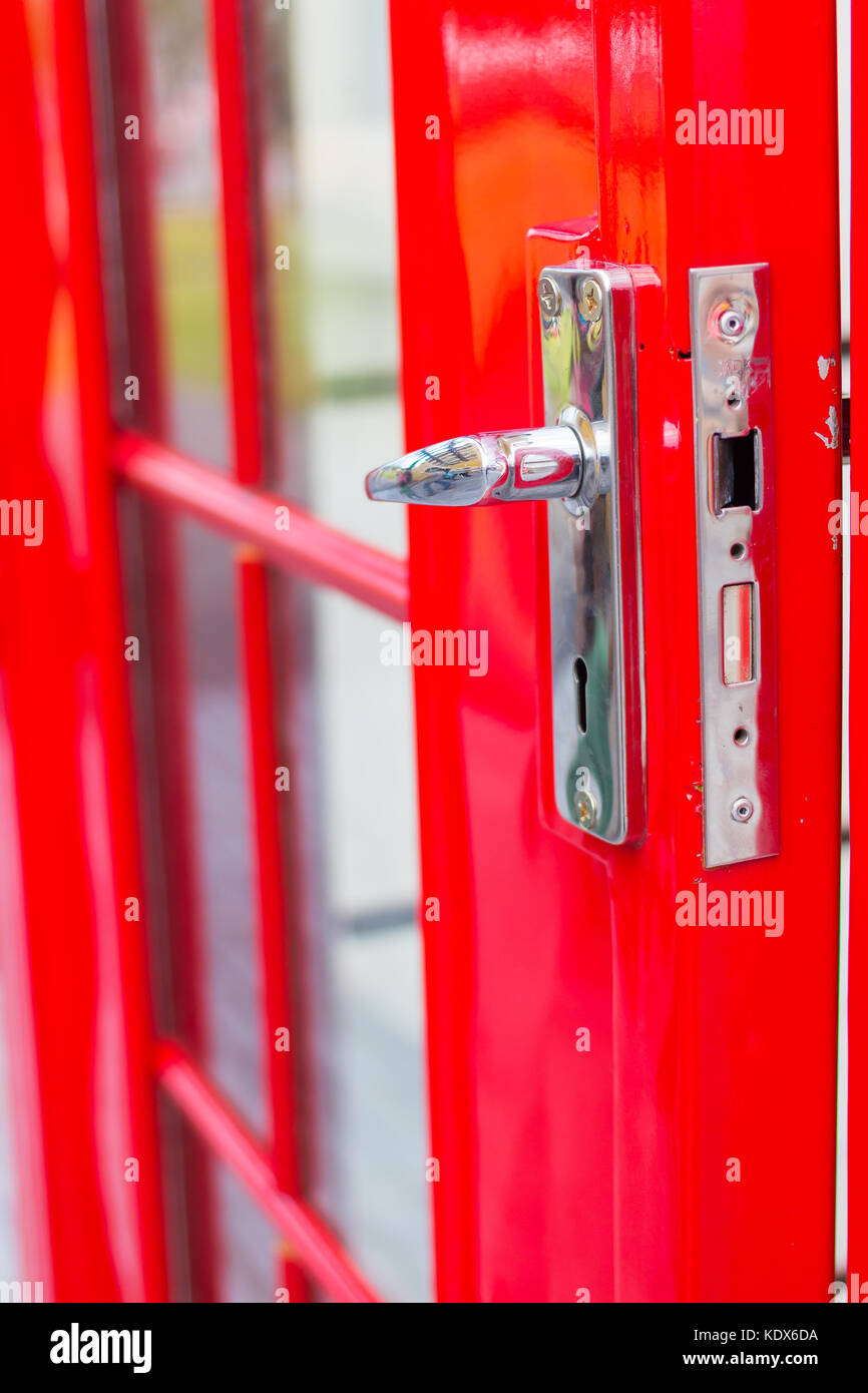 Red phone box door Stock Photo - Alamy
