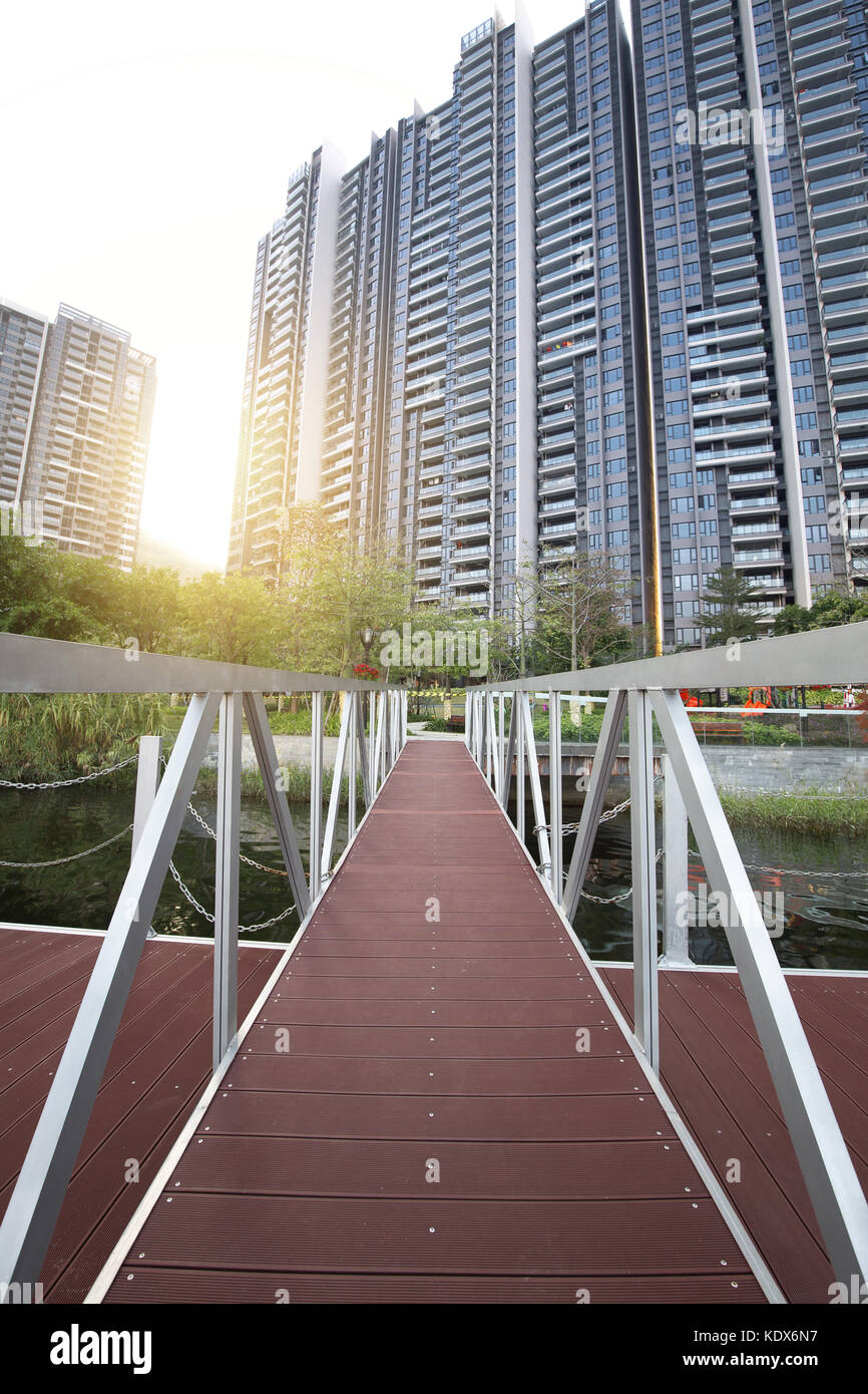 Footbridge with building Stock Photo - Alamy