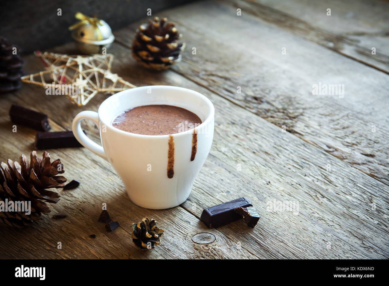 Hot Chocolate and chocolate pieces over rustic wooden background ...