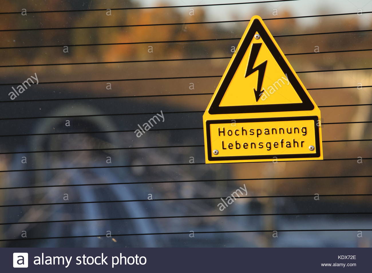A yellow warning sign near a railway building site in Germany Stock ...