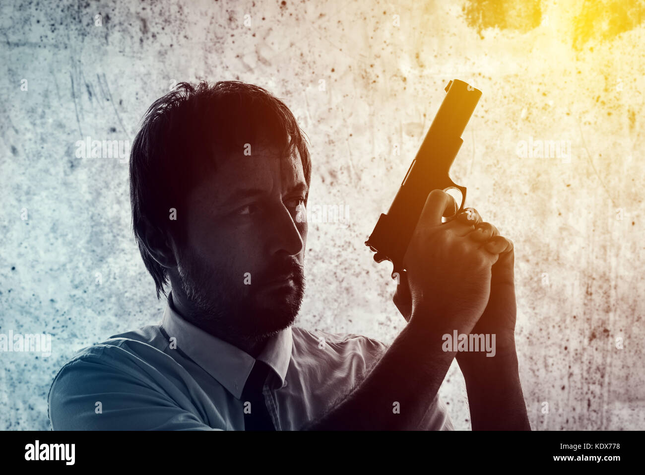 Man with a gun. Police officer, criminal investigation detective or ...