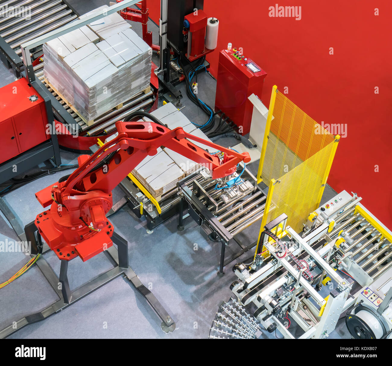 Robotic arm at production line with automatic conveyor belt, industry ...