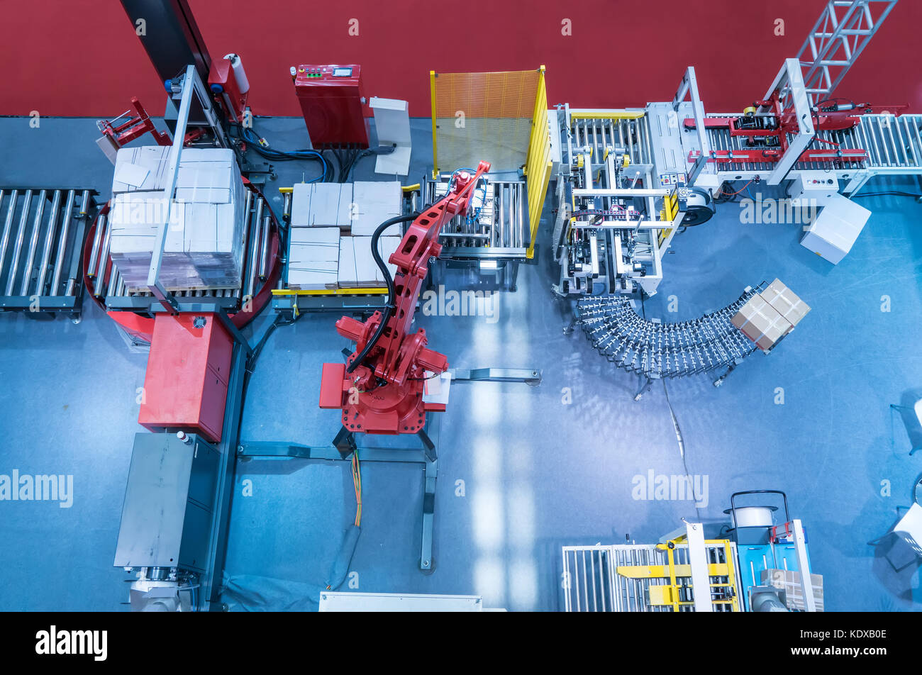 Robotic arm at production line with automatic conveyor belt, industry ...
