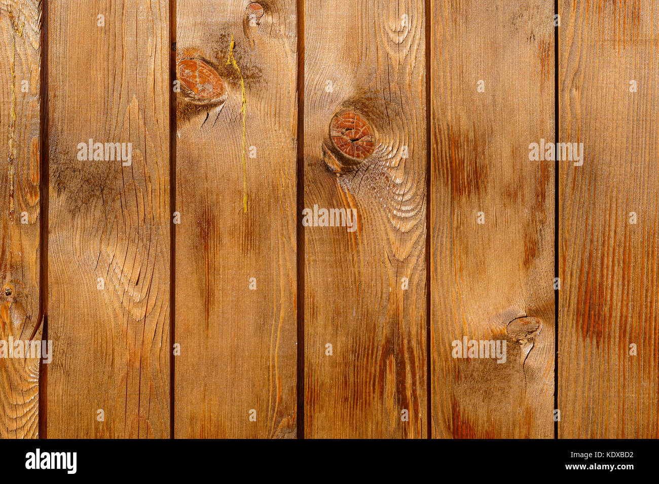 Row of tinted brown wooden boards with knots Stock Photo - Alamy