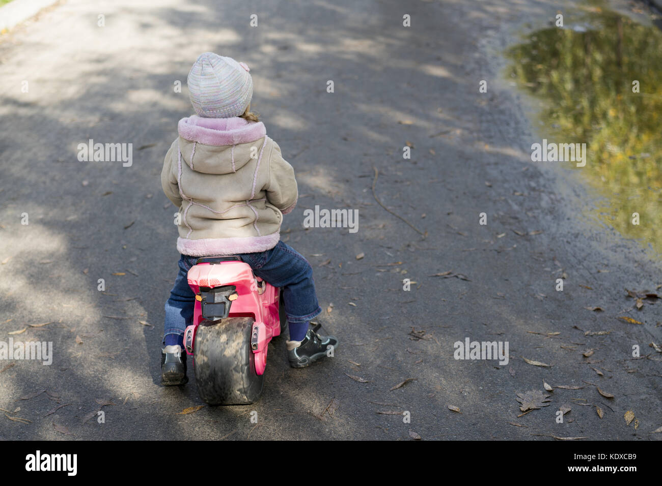 Boy wheeling bicycle hi-res stock photography and images - Alamy