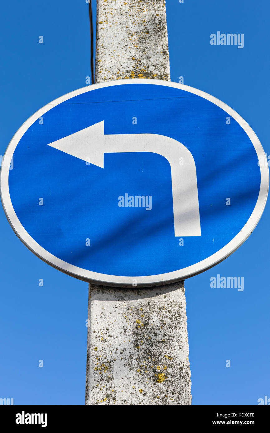 Mandatory turning left traffic sign hi-res stock photography and images ...