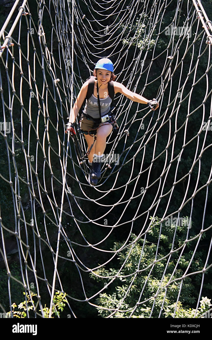 Marga crosses the net bridge (2 Stock Photo - Alamy