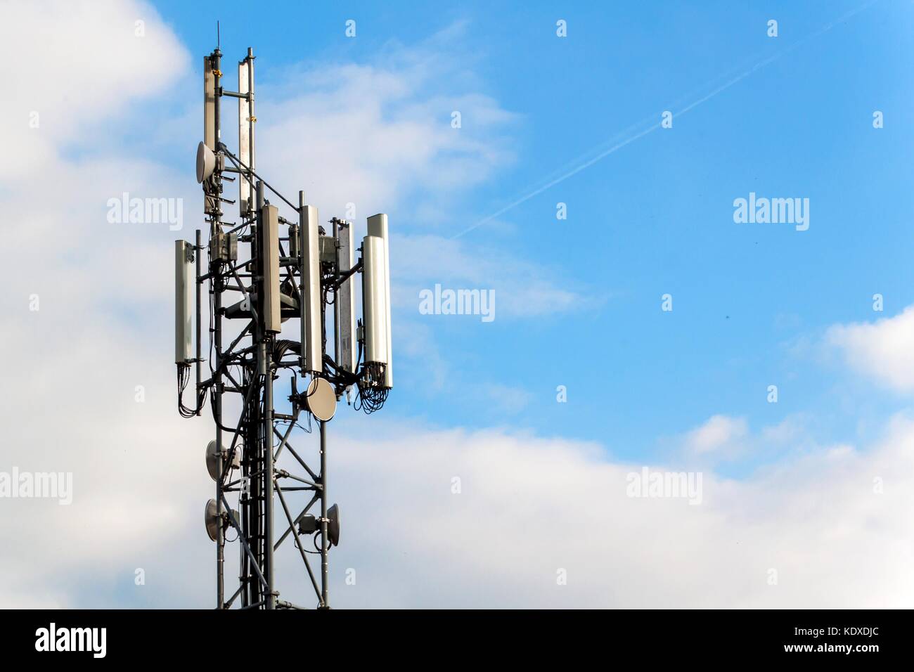 gsm column on a blue sky background. Mediation of the telephone signal ...