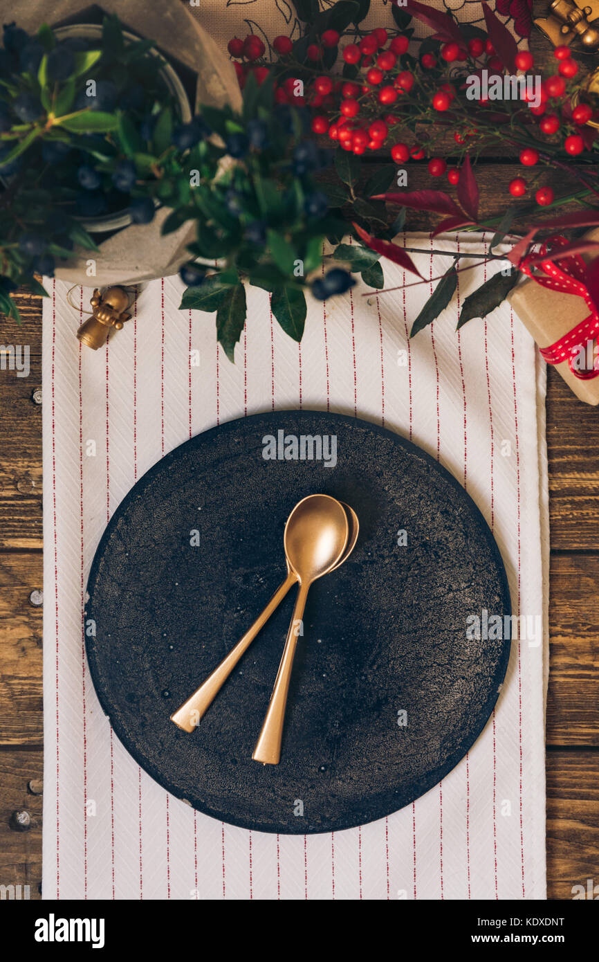 Holiday place setting, funny Christmas table with ornaments and natural ...