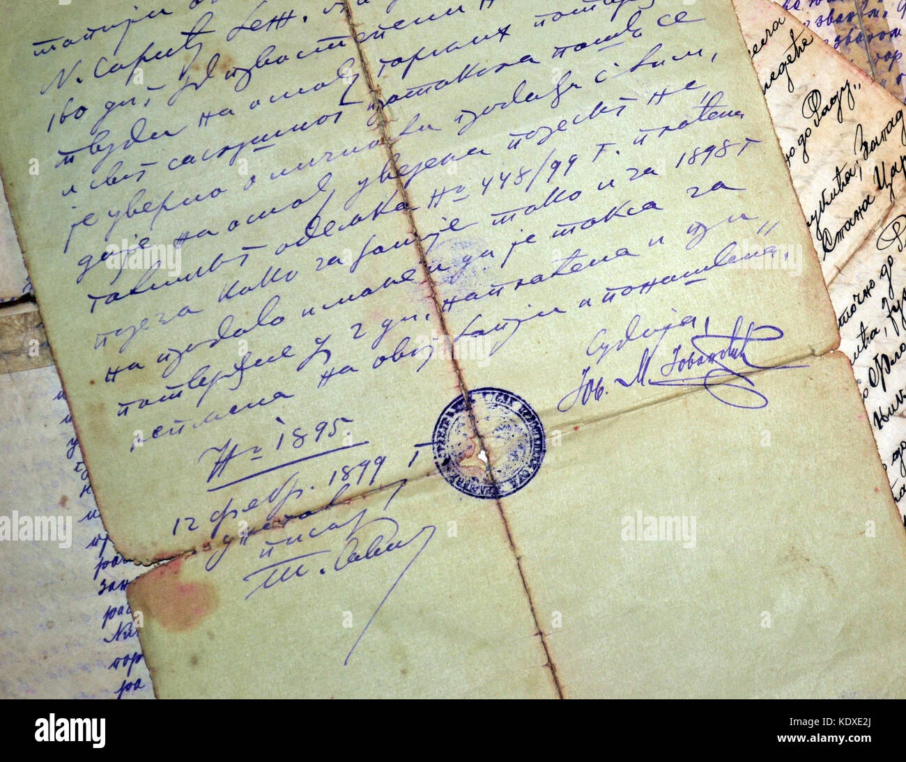 Old handwritten document with smudgy stamp written on old paper ...