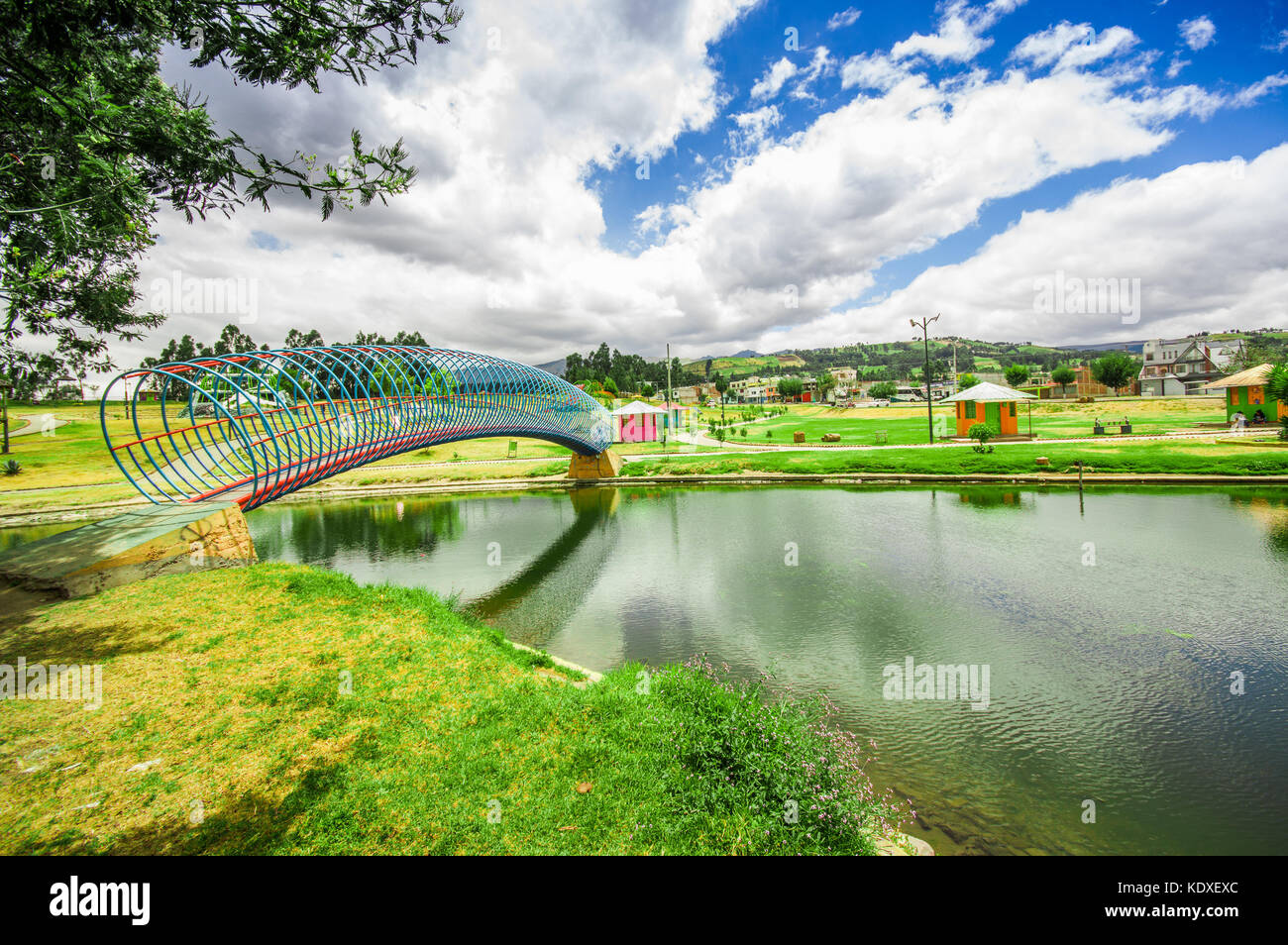 Beautiful colorful bridge over an artificial lake located in the midle ...