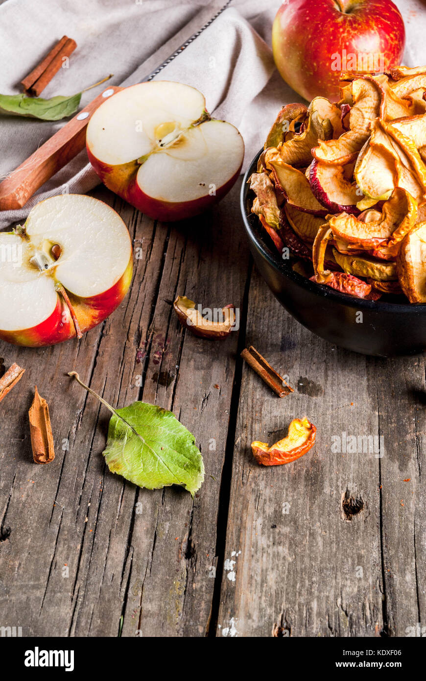 Homemade sun-dried organic apple slices, crispy apple chips, on an old ...