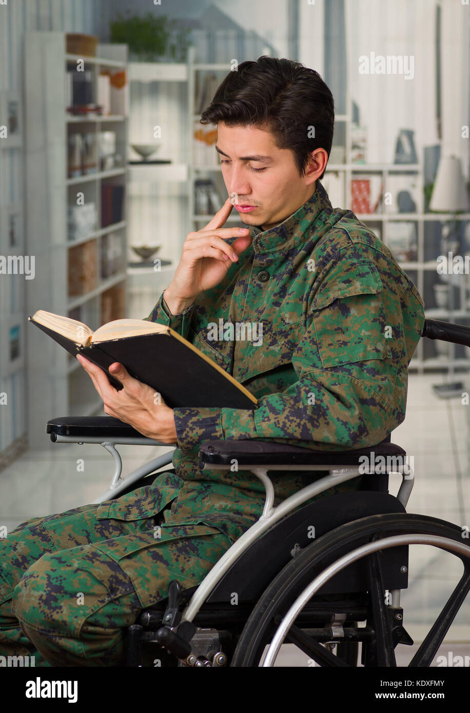 Male soldier sitting in chair hi-res stock photography and images - Alamy