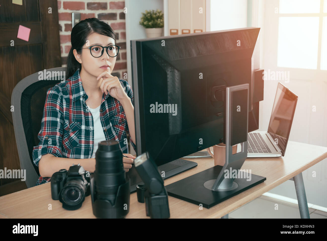 pretty calm female photographer woman working at office desk and ...