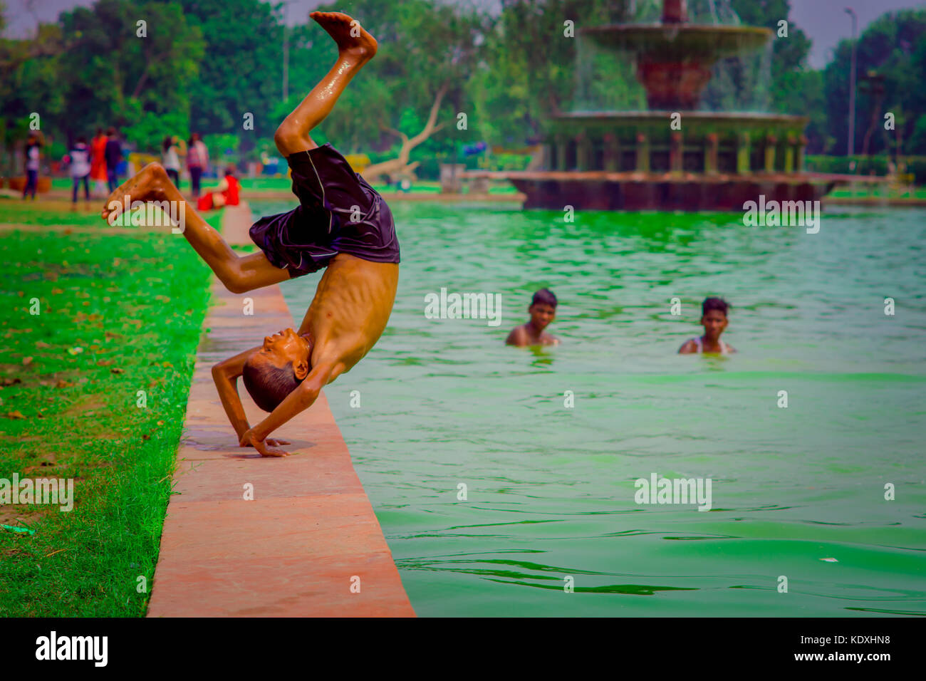 Young boys jump into a lake hi-res stock photography and images - Alamy