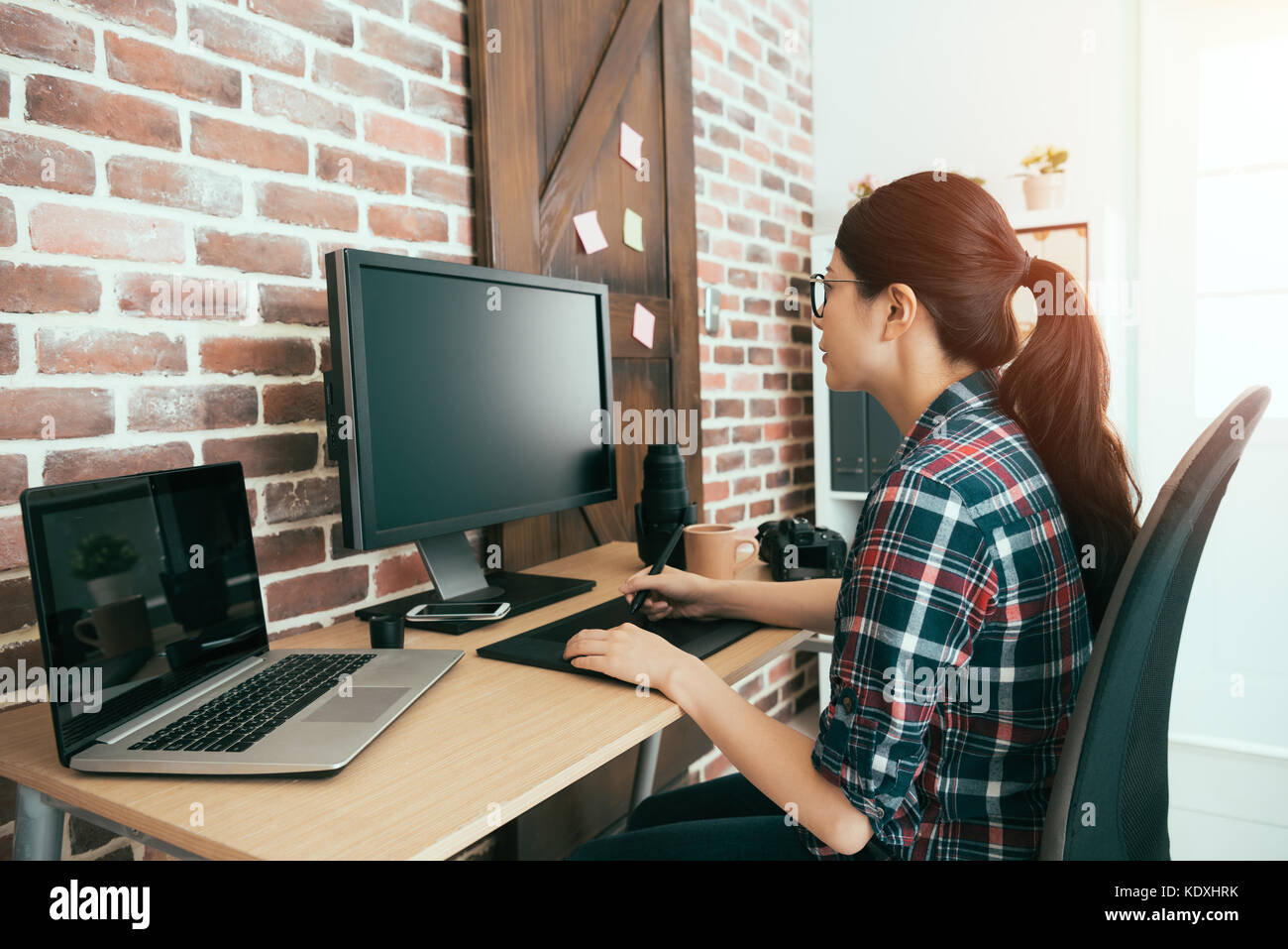 back view photo of pretty sweet female student doing homework on desk ...