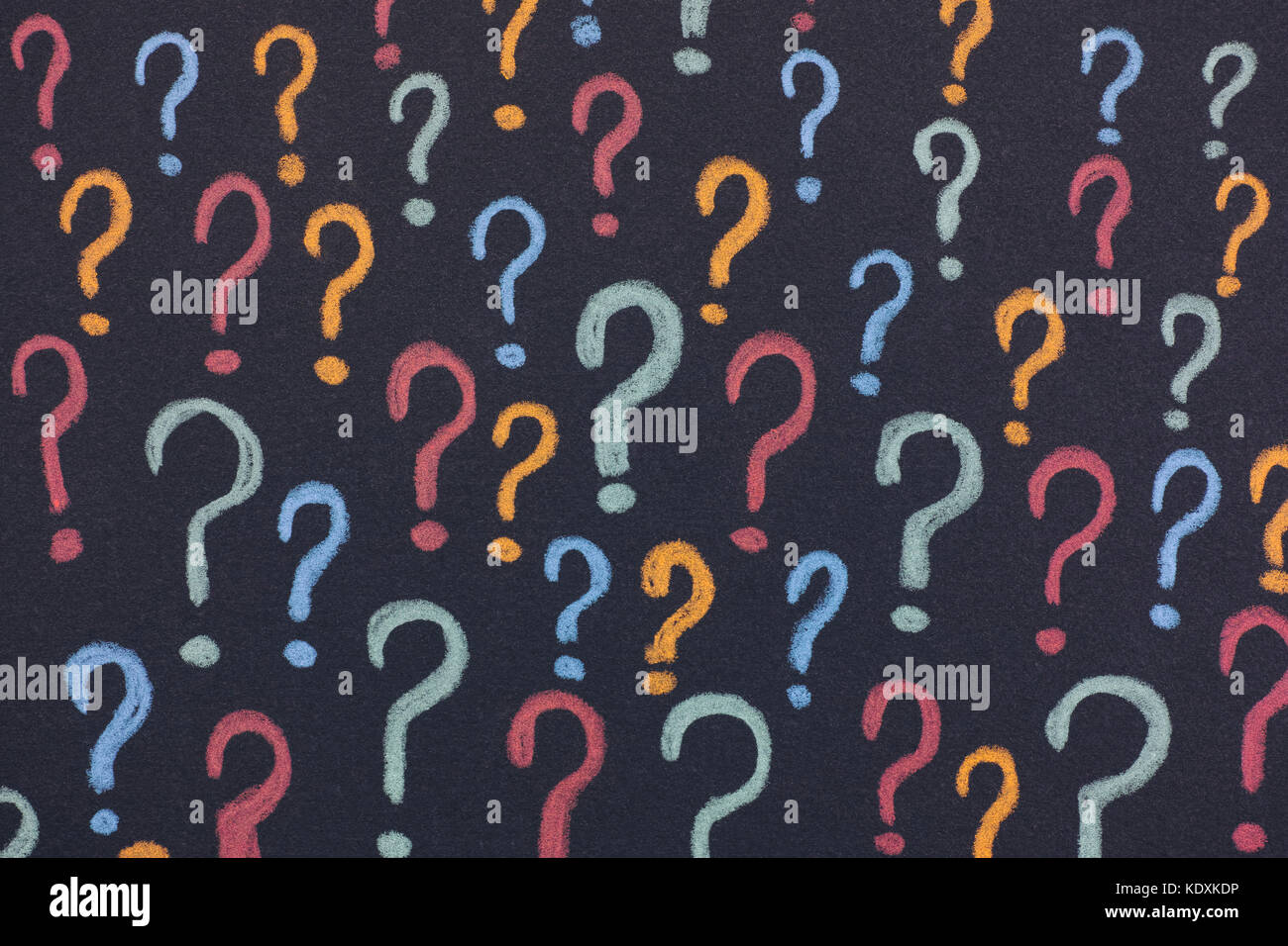 Colorful question marks on a black background. Close up Stock Photo - Alamy